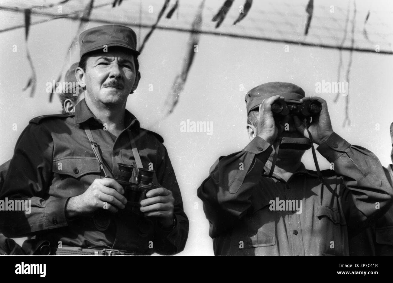 Cuba's Armed Forces Minister Raul Castro, left, looks on during ...