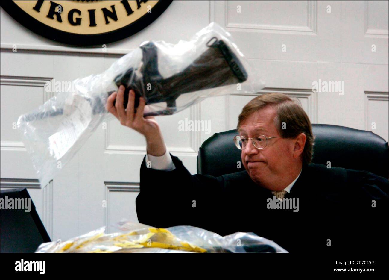 Circuit Judge Carl E. Eason, Jr. holds an AR-15 Bushmaster rifle on Oct ...