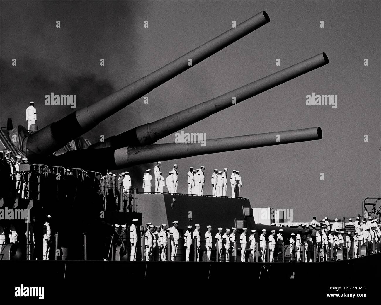 Sailors aboard the USS Iowa wore black armbands as the ship, with its ...