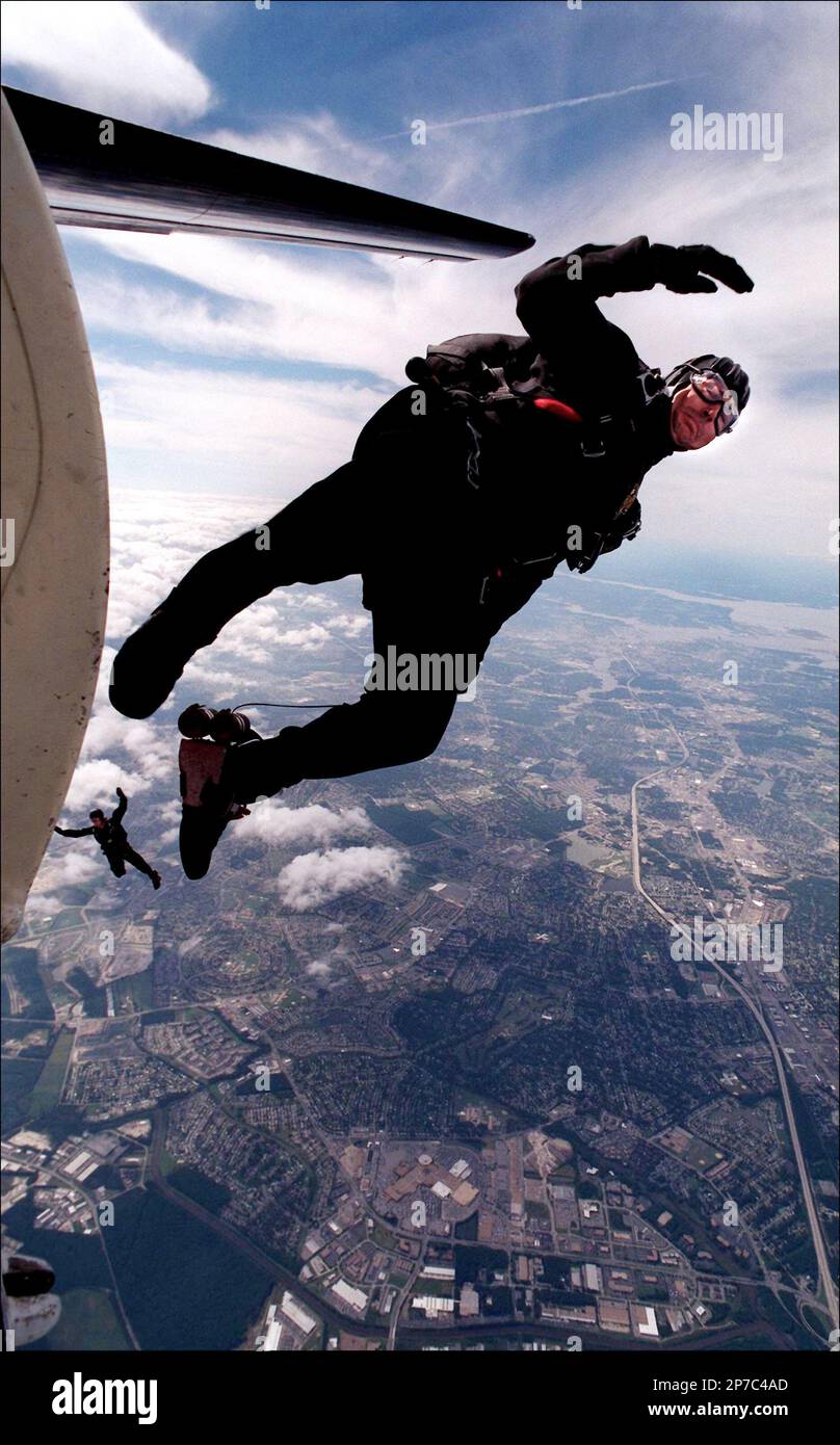 Two members of the Golden Knights, the U.S. Army’s Parachute Team, exit ...