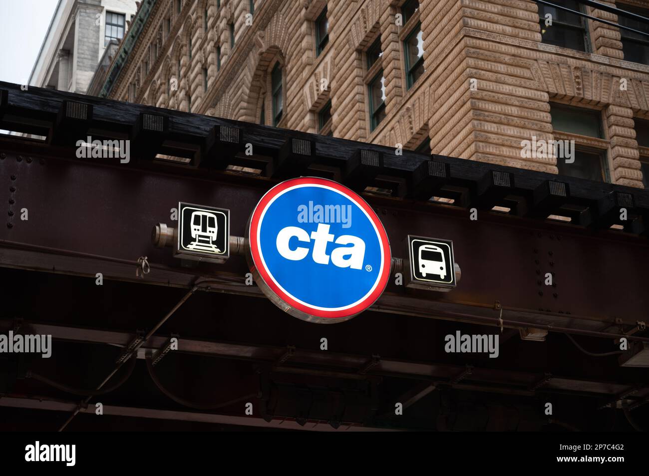 A street sign of Chicago Transit Authority hanging over a bridge next ...