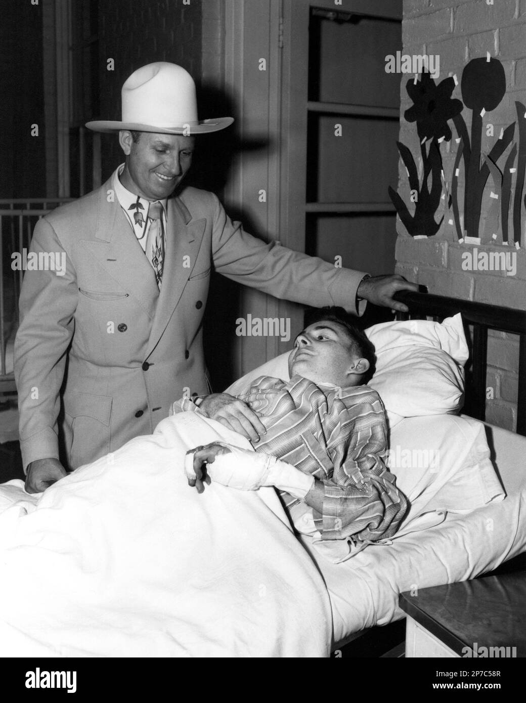 Gene Autry visiting a hospital, Norfolk, Va., April 12, 1948. Courtesy ...