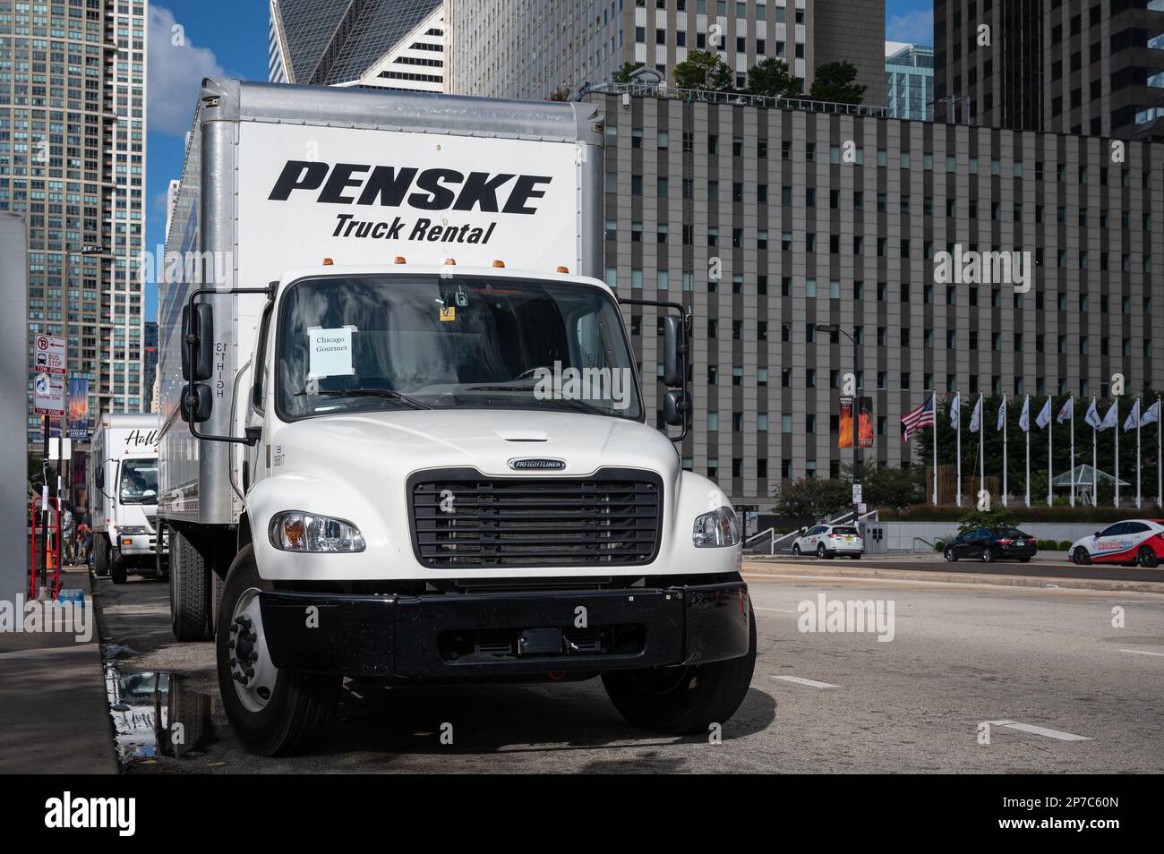A white Penske rental truck on the road in an urban setting Stock Photo ...