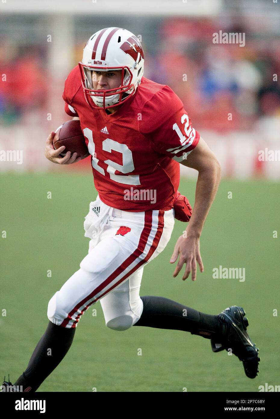 Wisconsin Badgers quarterback Nate Tice (12) scores a rushing touchdown ...