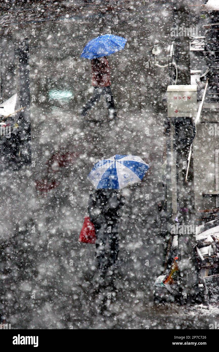 Local residents walk amid heavy snow in Shenyang in northeast China's ...
