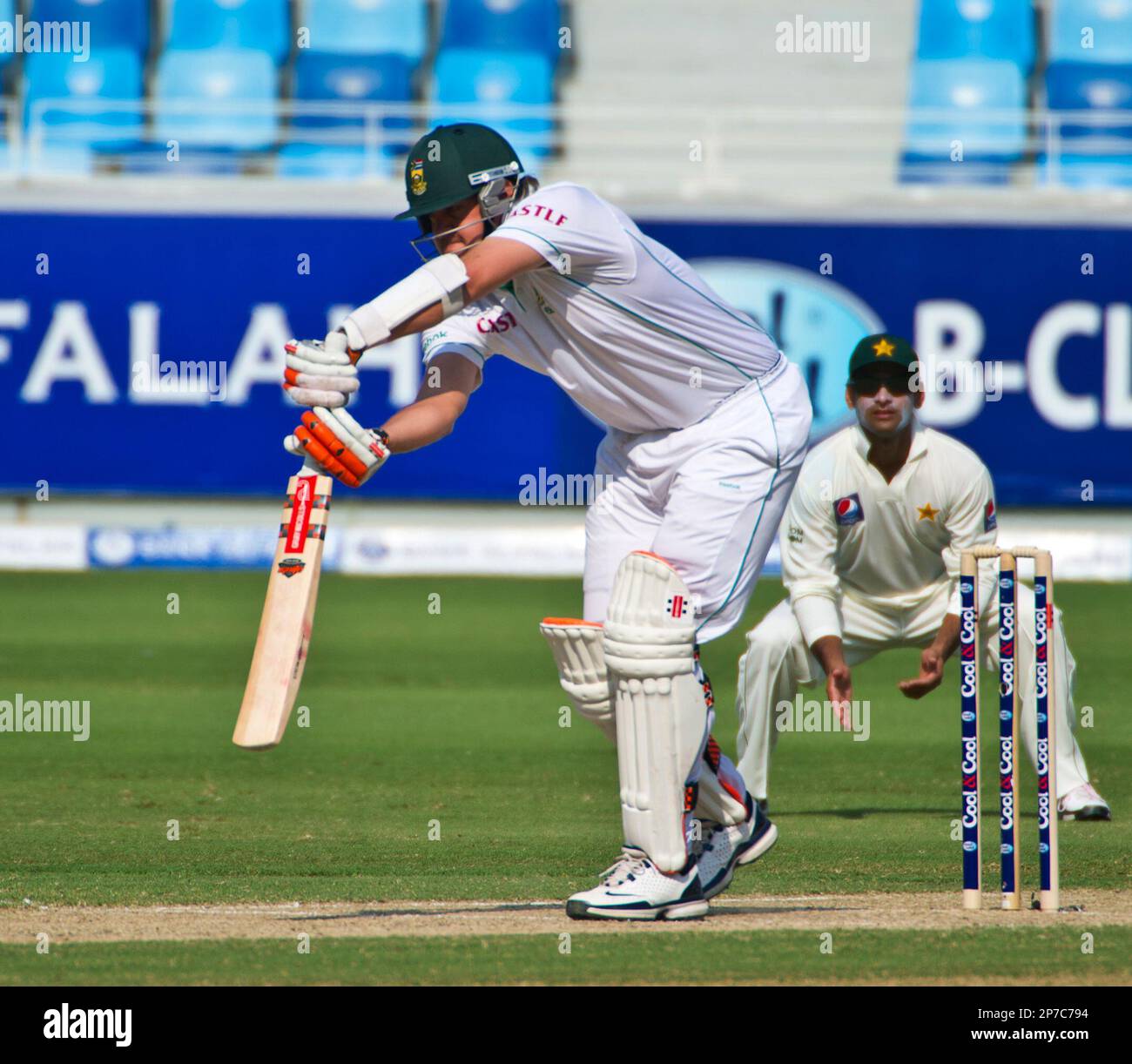 South Africa's Paul Harris plays a shot with Mohammad Hafeez of ...