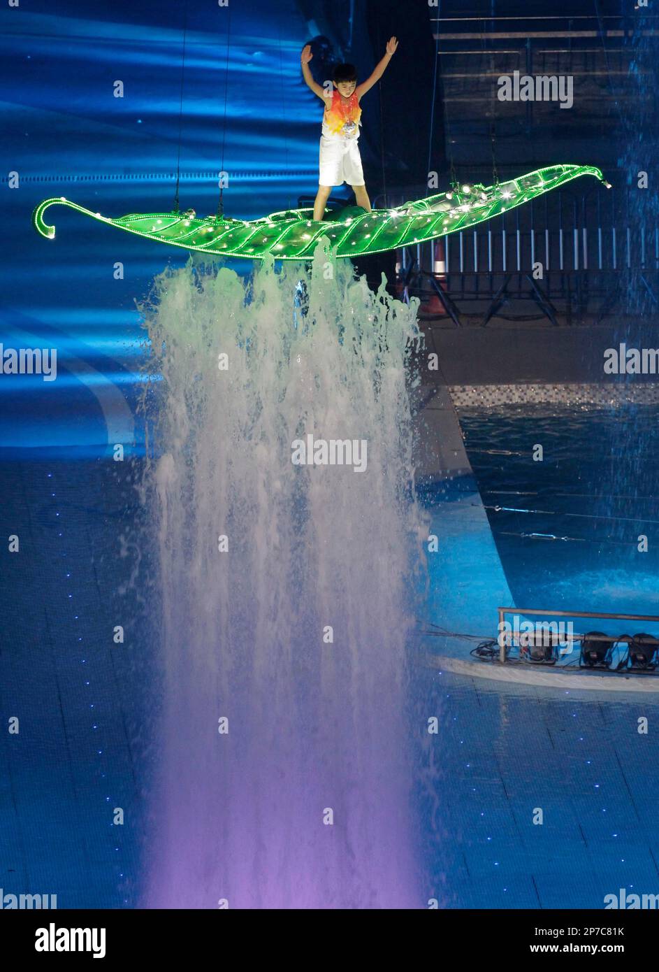 A young boy appears to float on a spout of water during the opening ...