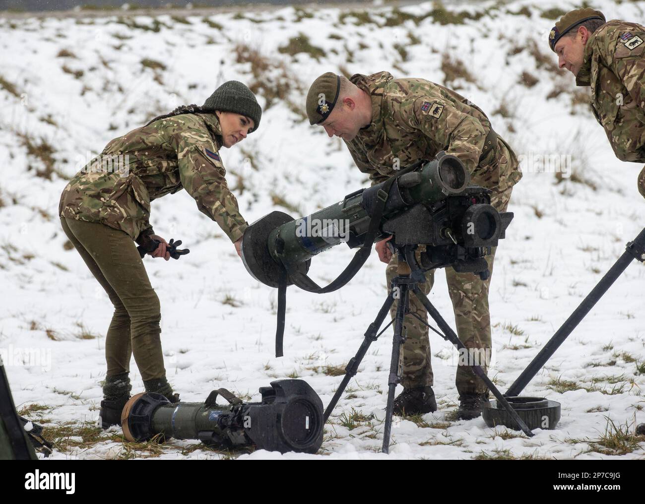 The Princess of Wales, Colonel of the Irish Guards, is shown a weapon ...