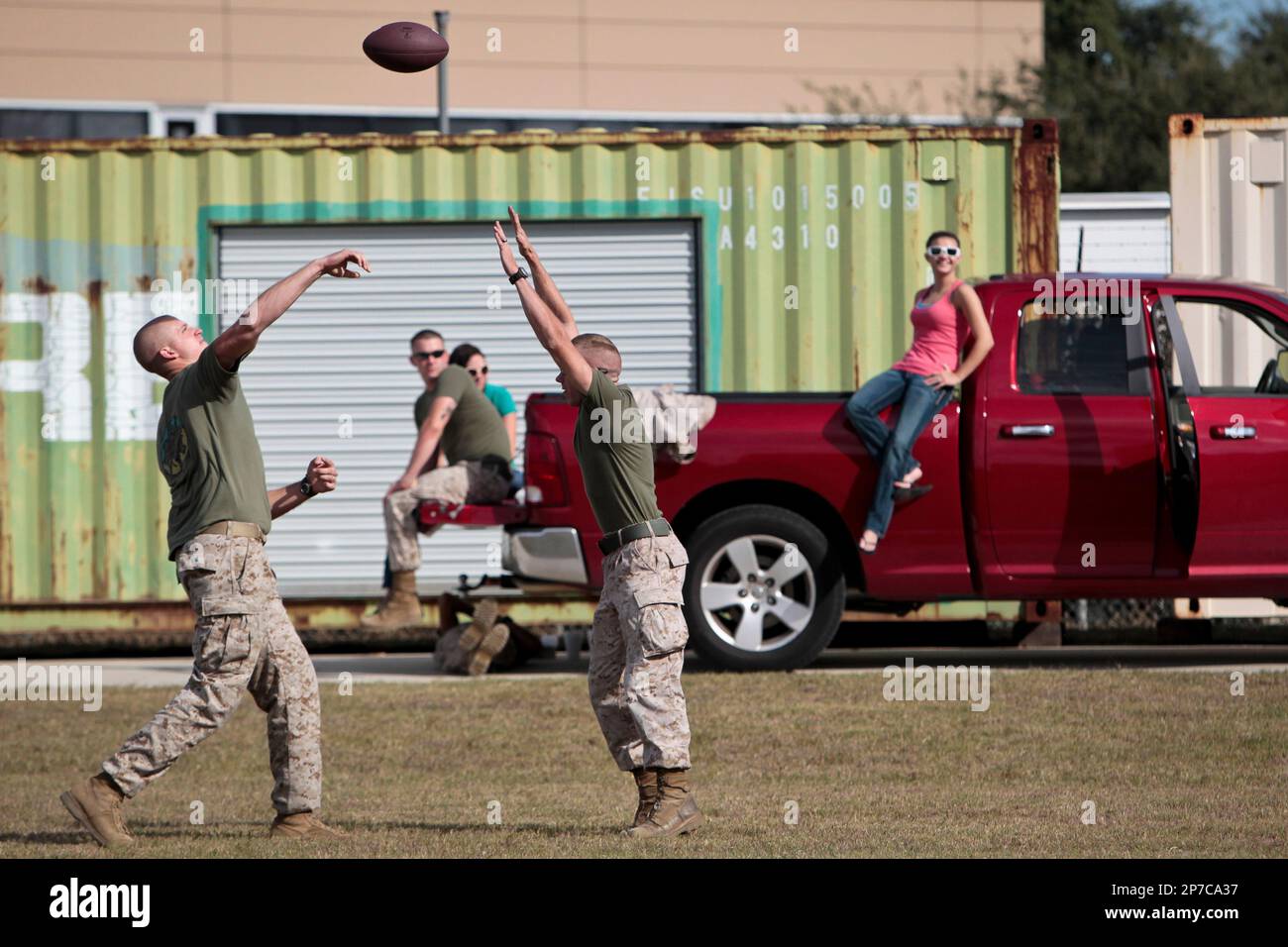 Marines play football before boarding a bus at the Armed Forces Reserve ...