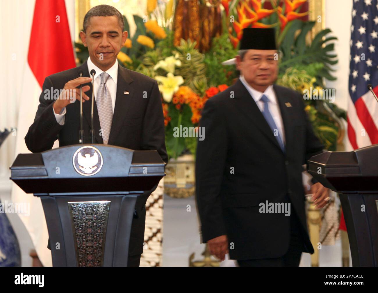 U.S. President Barack Obama, left, adjusts a microphone as Indonesian ...