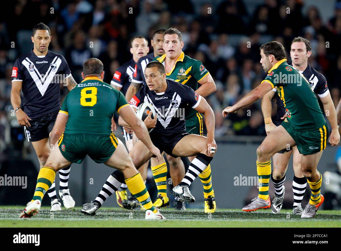 New Zealand's Sam Perrett runs the ball agaisnt Australia's Matthew ...