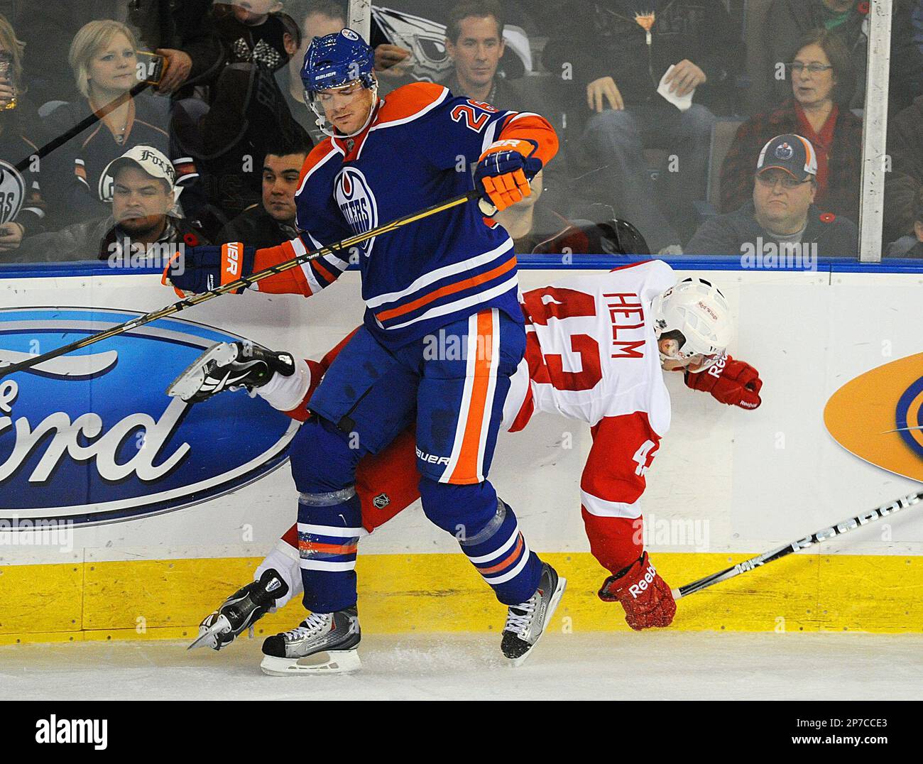 Edmonton Oilers' Kurtis Foster, left, checks Detroit Red Wings' Darren ...
