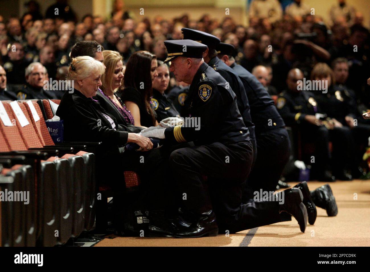 San Diego Police Chief William Lansdowne presents the flag from the ...