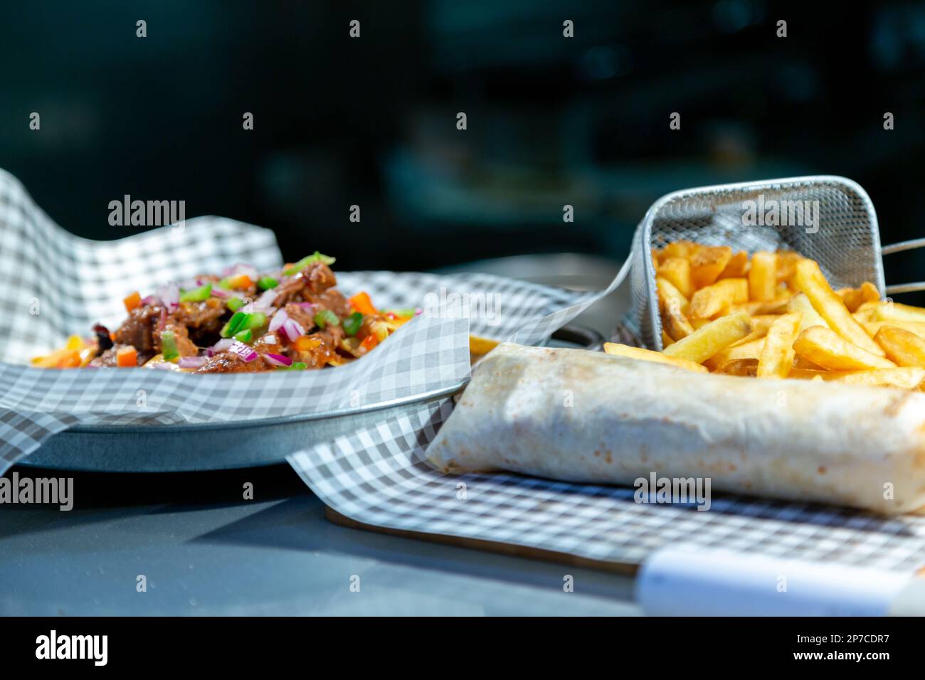 chicken wrap with french fries with beef loaded nachos Stock Photo - Alamy