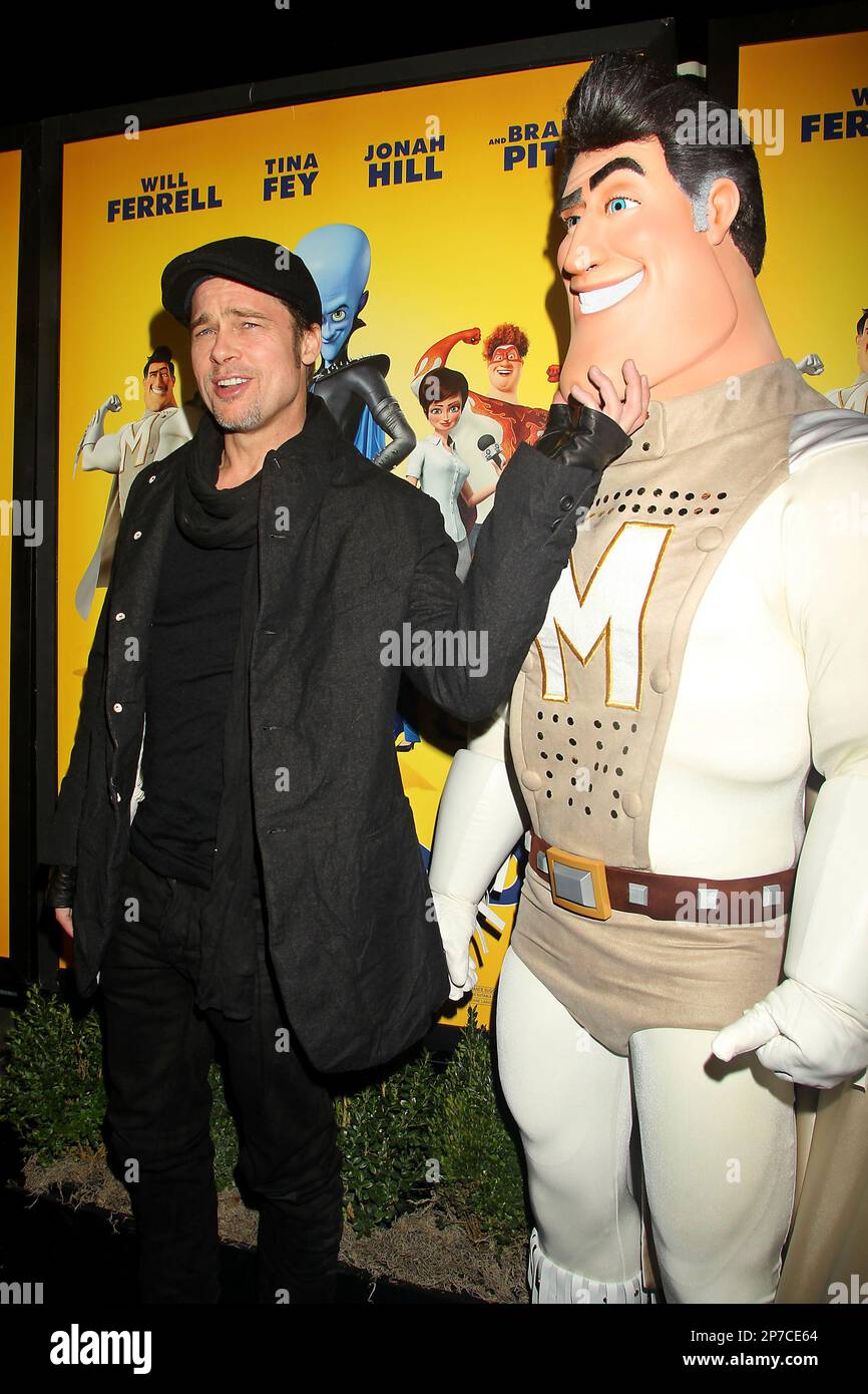 In this photo released by Starpix, actor Brad Pitt, left, poses with an ...