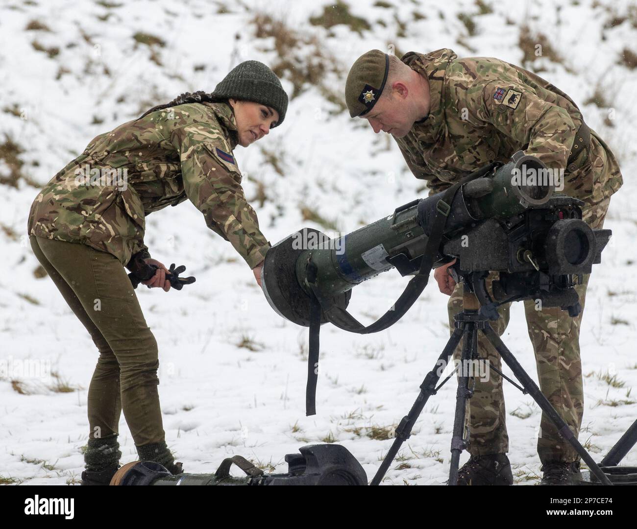 The Princess of Wales, Colonel of the Irish Guards, is shown a weapon ...