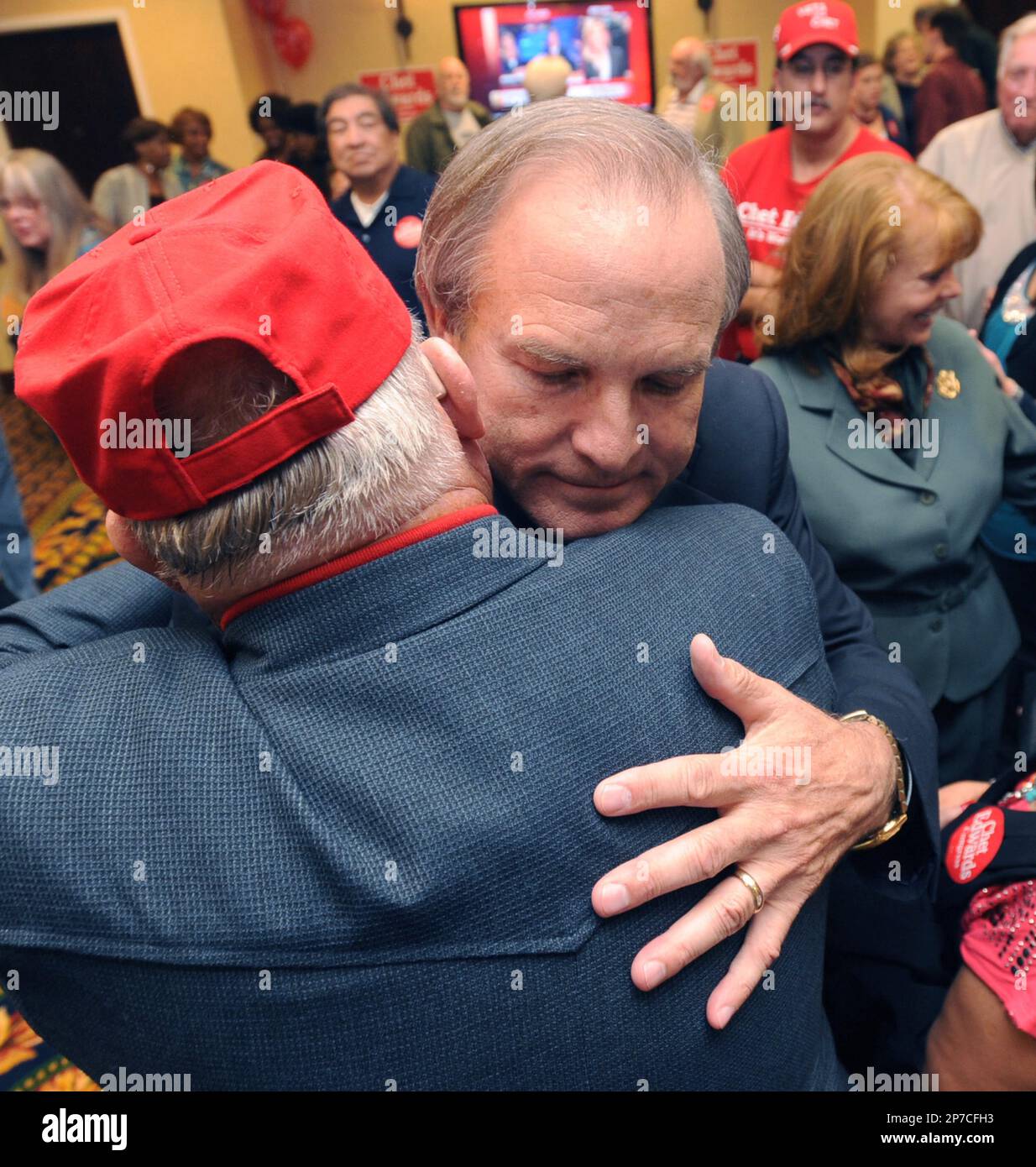 U.S. Rep. Chet Edwards, D-Texas, right, gets a hug from supporter Roger ...
