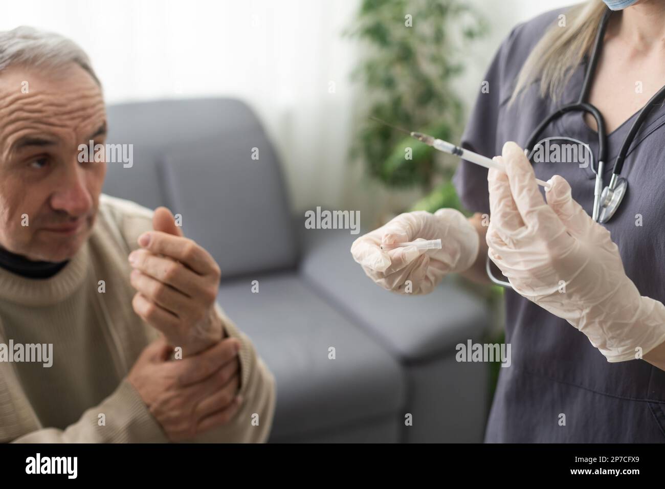 Woman getting vaccine home hi-res stock photography and images - Alamy