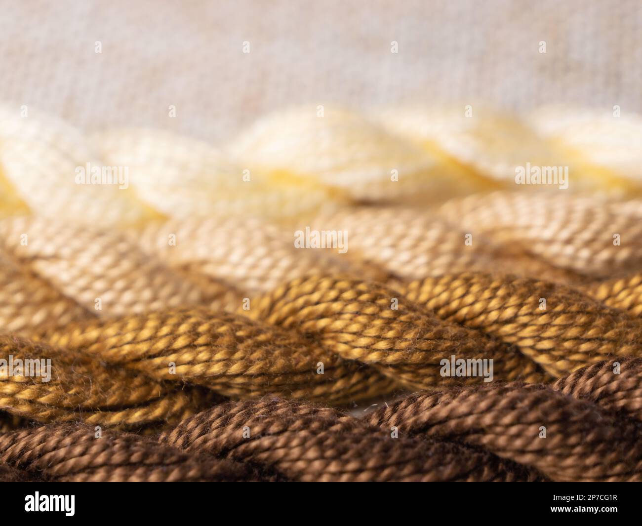 sewing threads for embroidery in beige tones close-up. Hobby, handmade ...