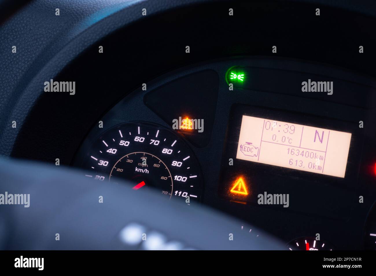 Digital tachograph with an open printer and visible roll of paper ...