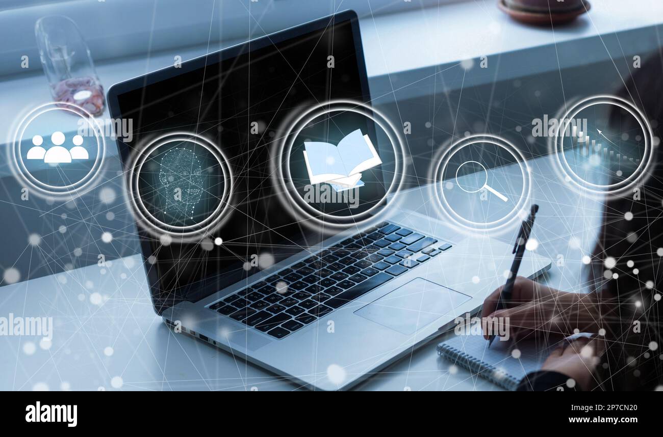 Document Management System (DMS) being setup by IT consultant working on laptop computer in ...