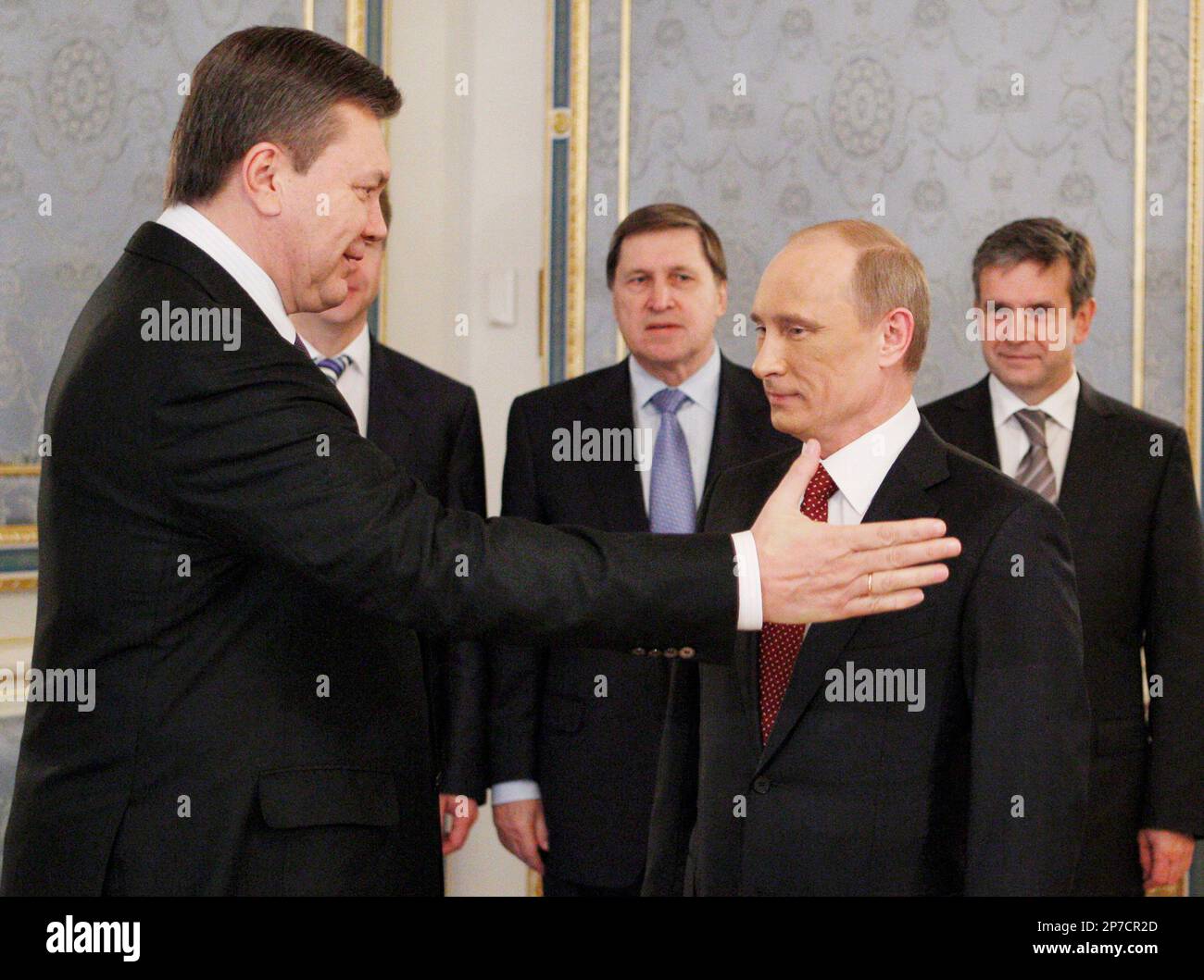 Russian Prime Minister Vladimir Putin, right, and Ukrainian President ...