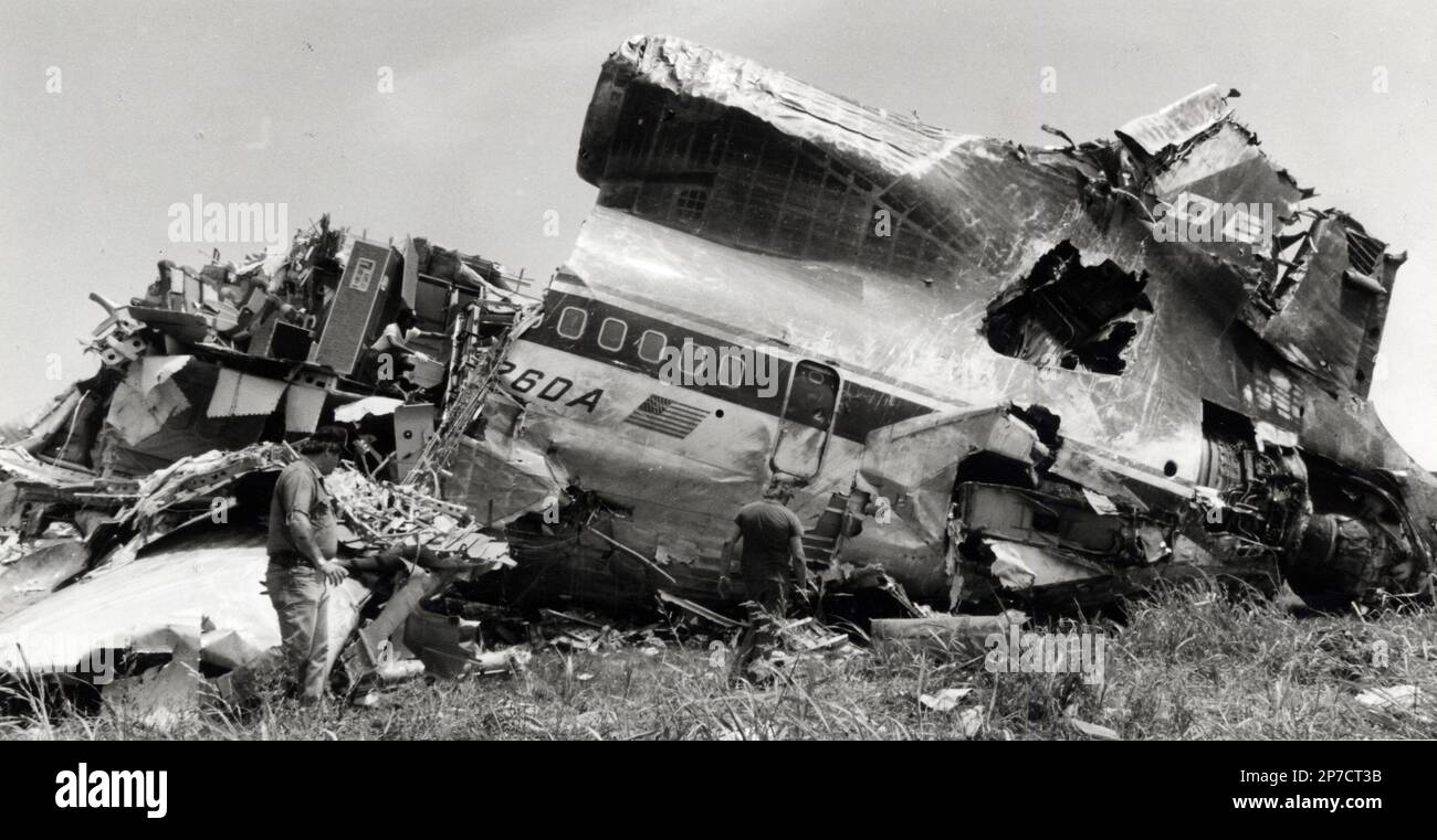 The hulking, charred tail section of the Lockheed L-1011 aircraft is a ...