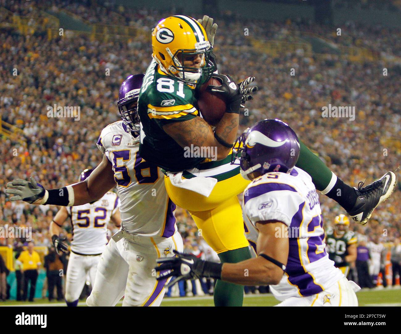 Green Bay Packers tight end Andrew Quarless catches a 9-yard touchdown ...