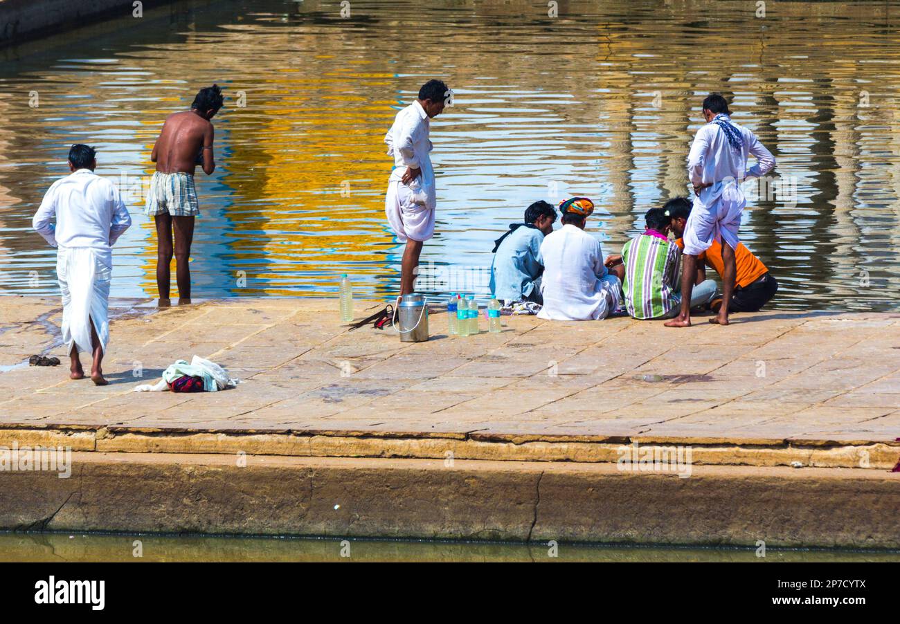 Pushkar, India - October 20, 2012: people at rituell washing in the ...