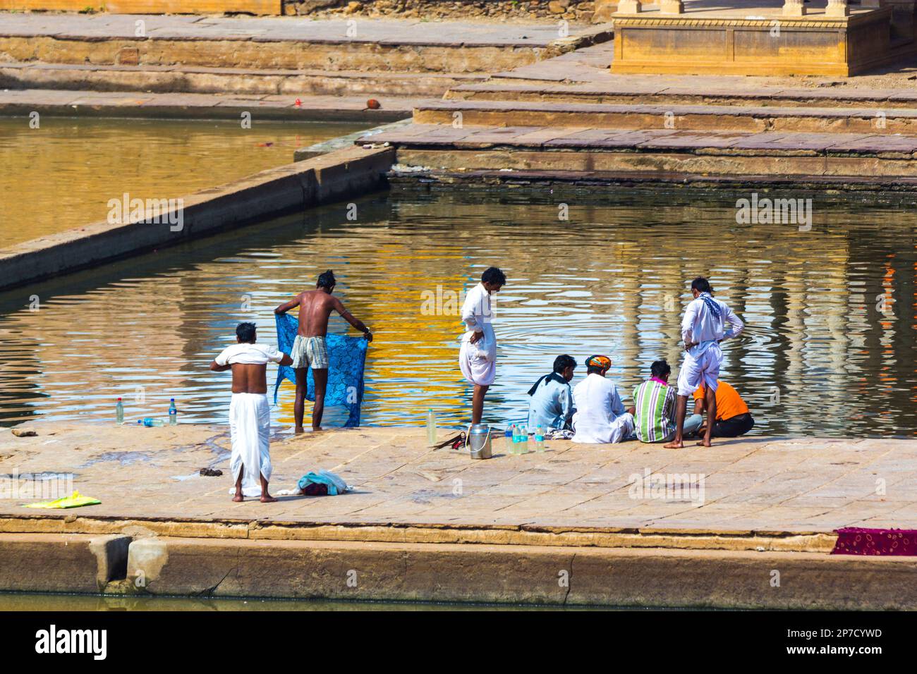 Pushkar, India - October 20,2012: people at rituell washing in the holy ...