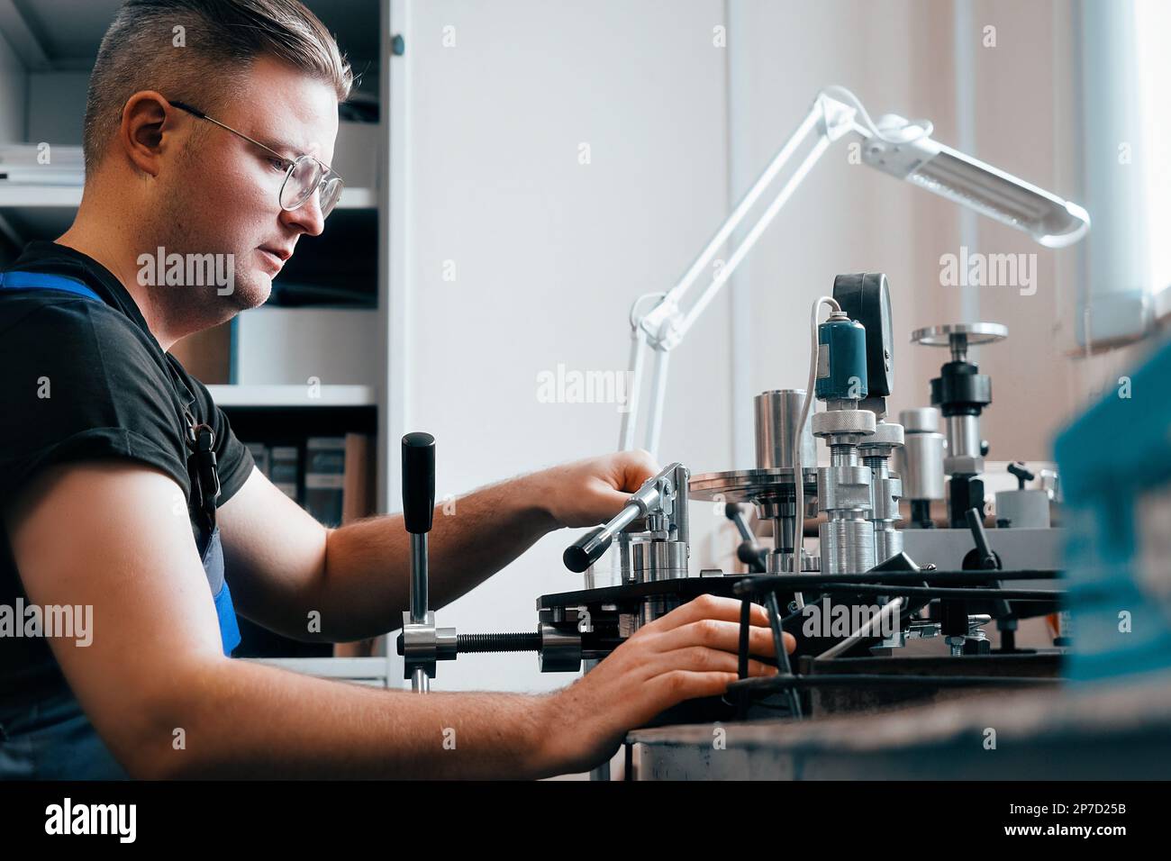 Professional calibration of pressure gauges and sensors. Working man is ...