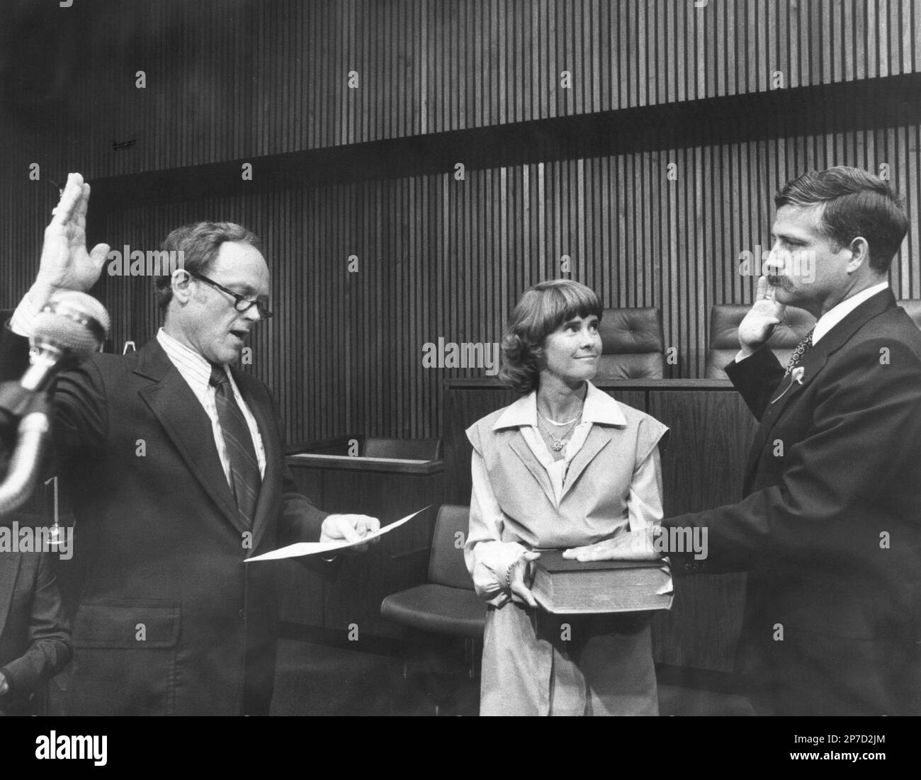John Holmes, Jr. aka Johnny Holmes (right) is sworn in Wednesday as ...
