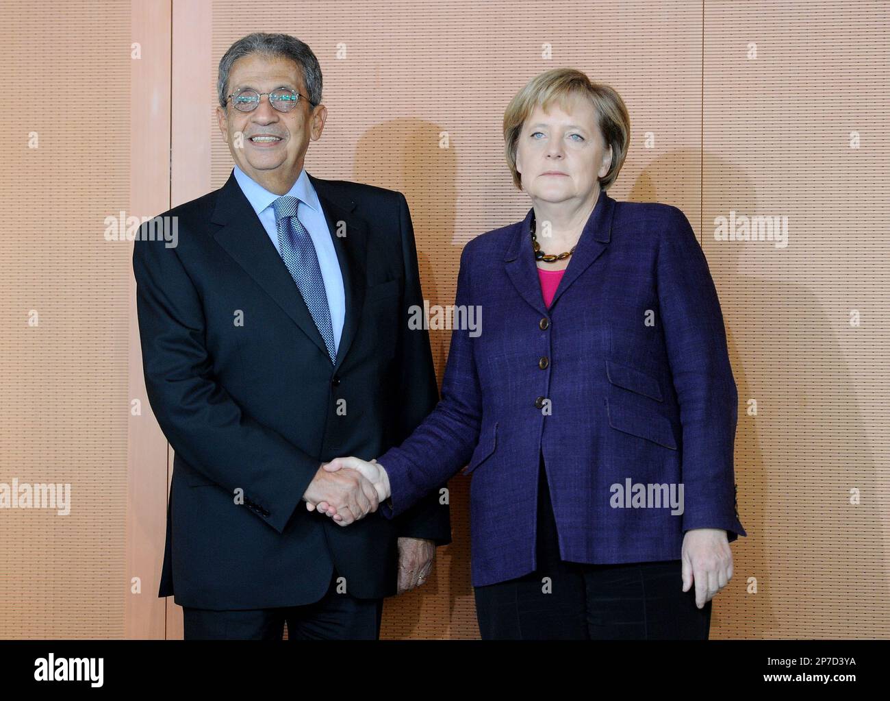 German chancellor Angela Merkel, right, welcomes the Secretary-General ...