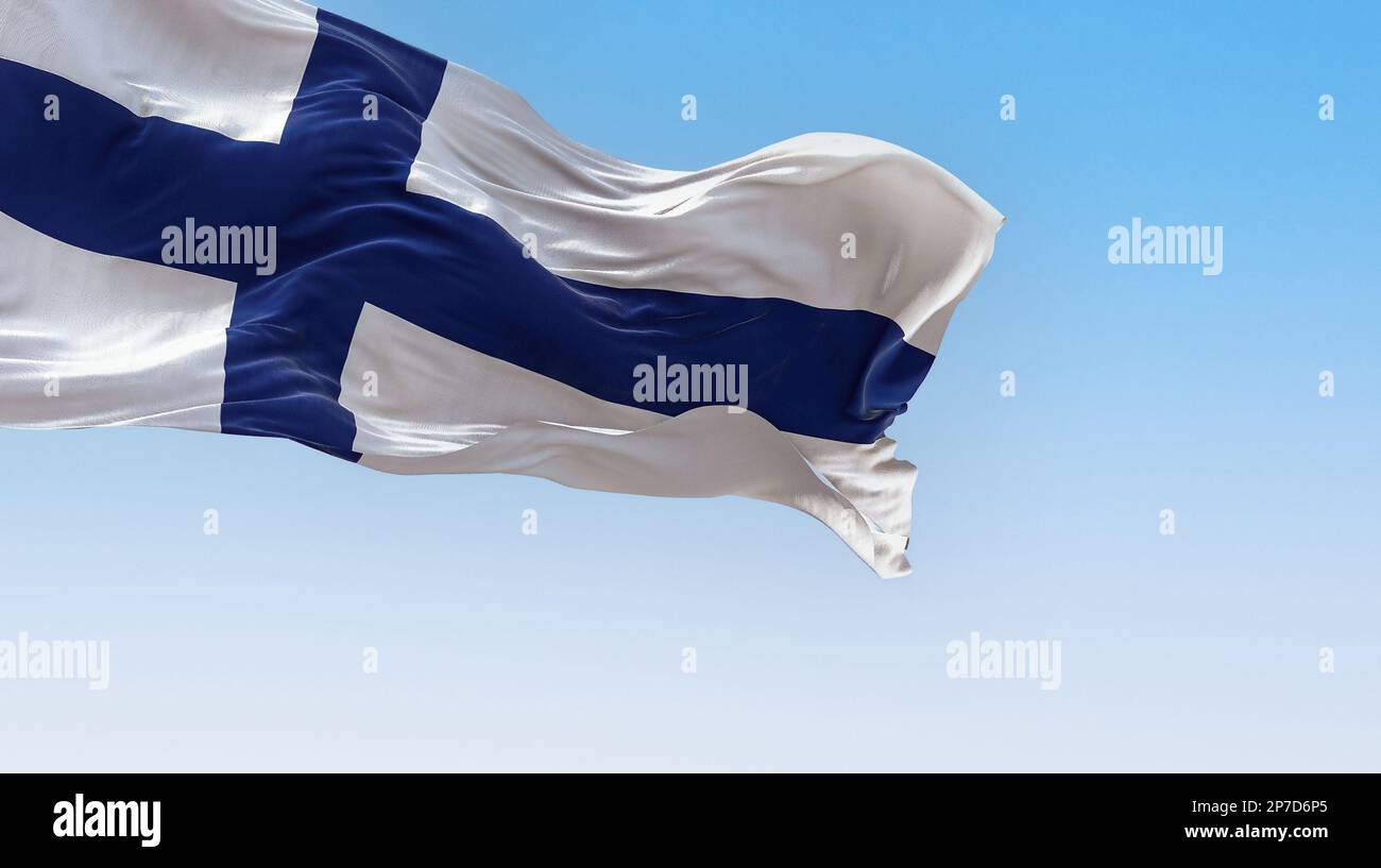The national flag of Finland waving in the wind on a clear day. Blue ...