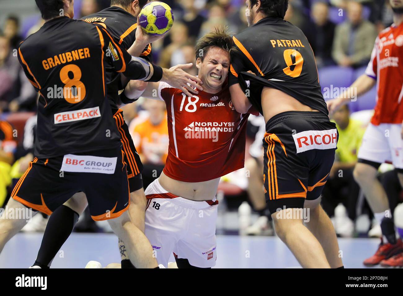 AAB's Olof Ask, centre, tries to get between David Graubner, left, and ...