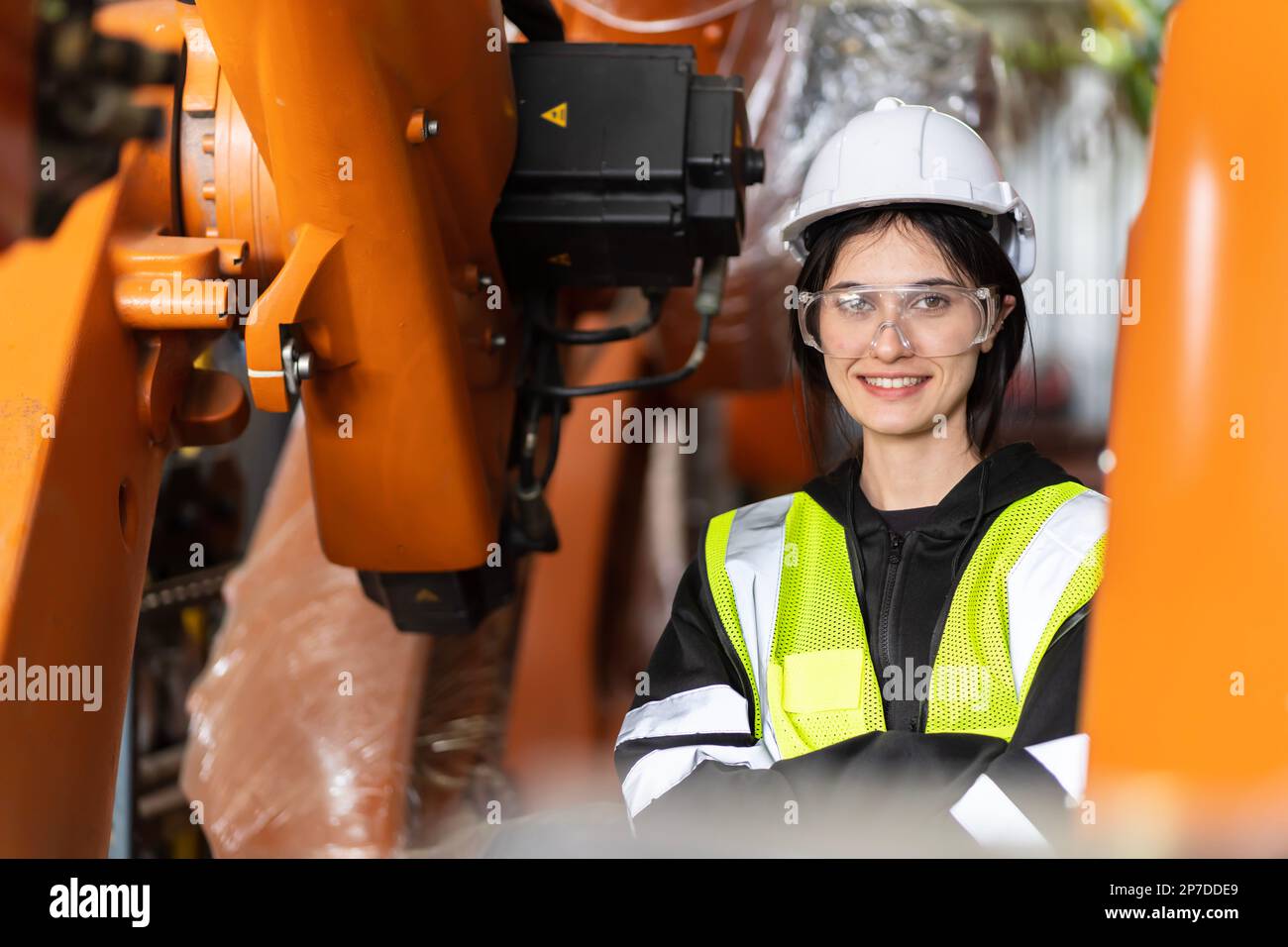 A team of female engineers meeting to inspect computer-controlled steel ...