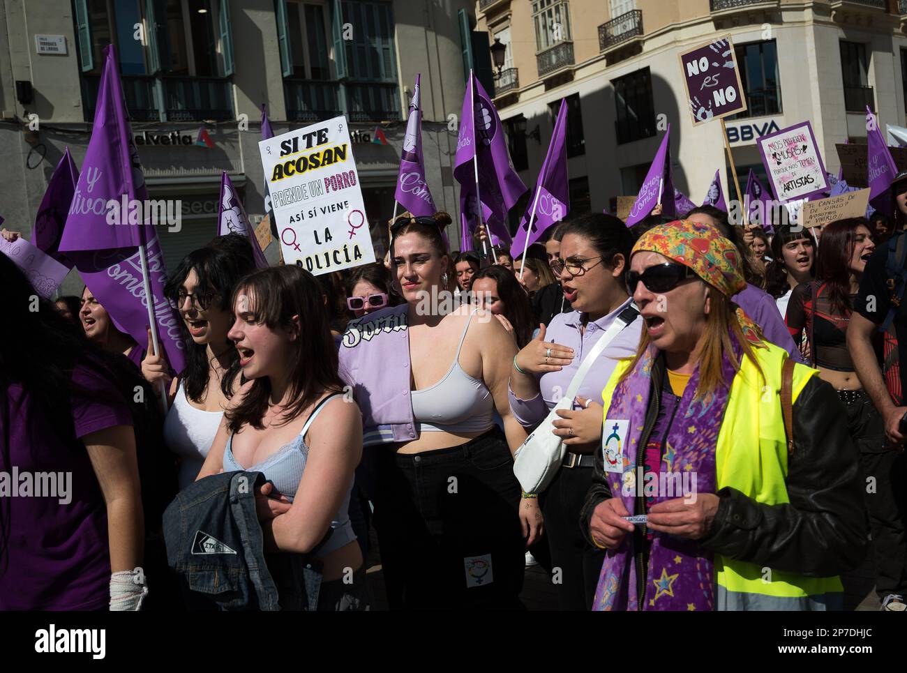 Women are seen holding placards and flags as they take part during a ...