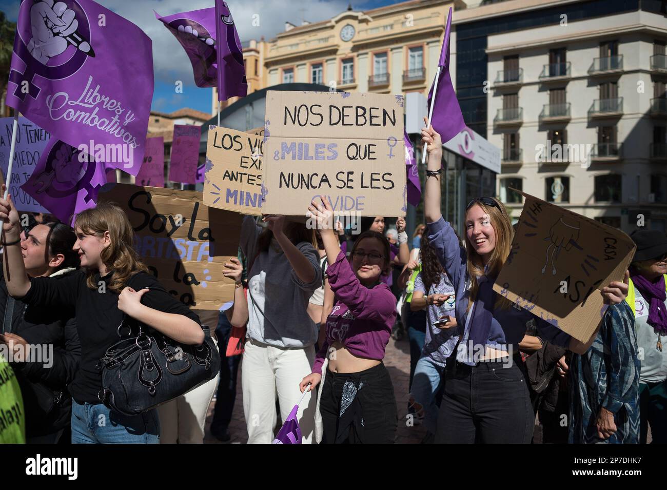 Women are seen holding placards as they take part during a student ...