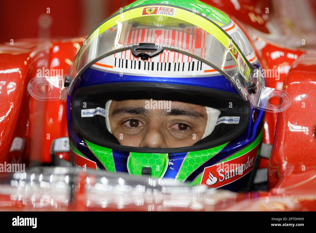 Ferrari Formula One driver Felipe Massa of Brazil waits in his car ...