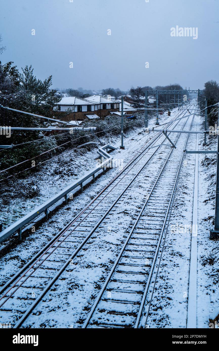 Railway line covered in snow. Winter landscape with empty rail tracks ...