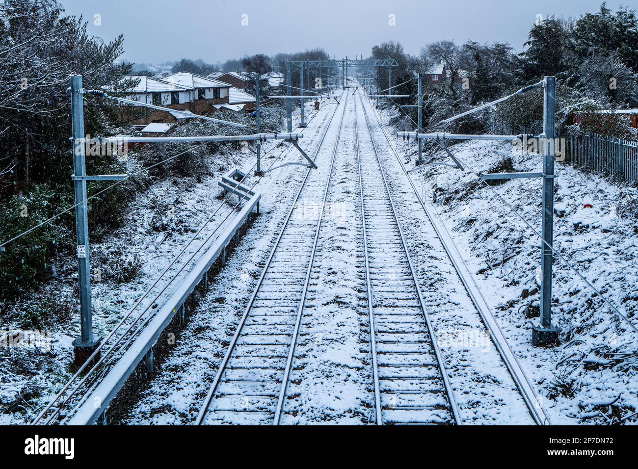 Railway line covered in snow. Winter landscape with empty rail tracks ...