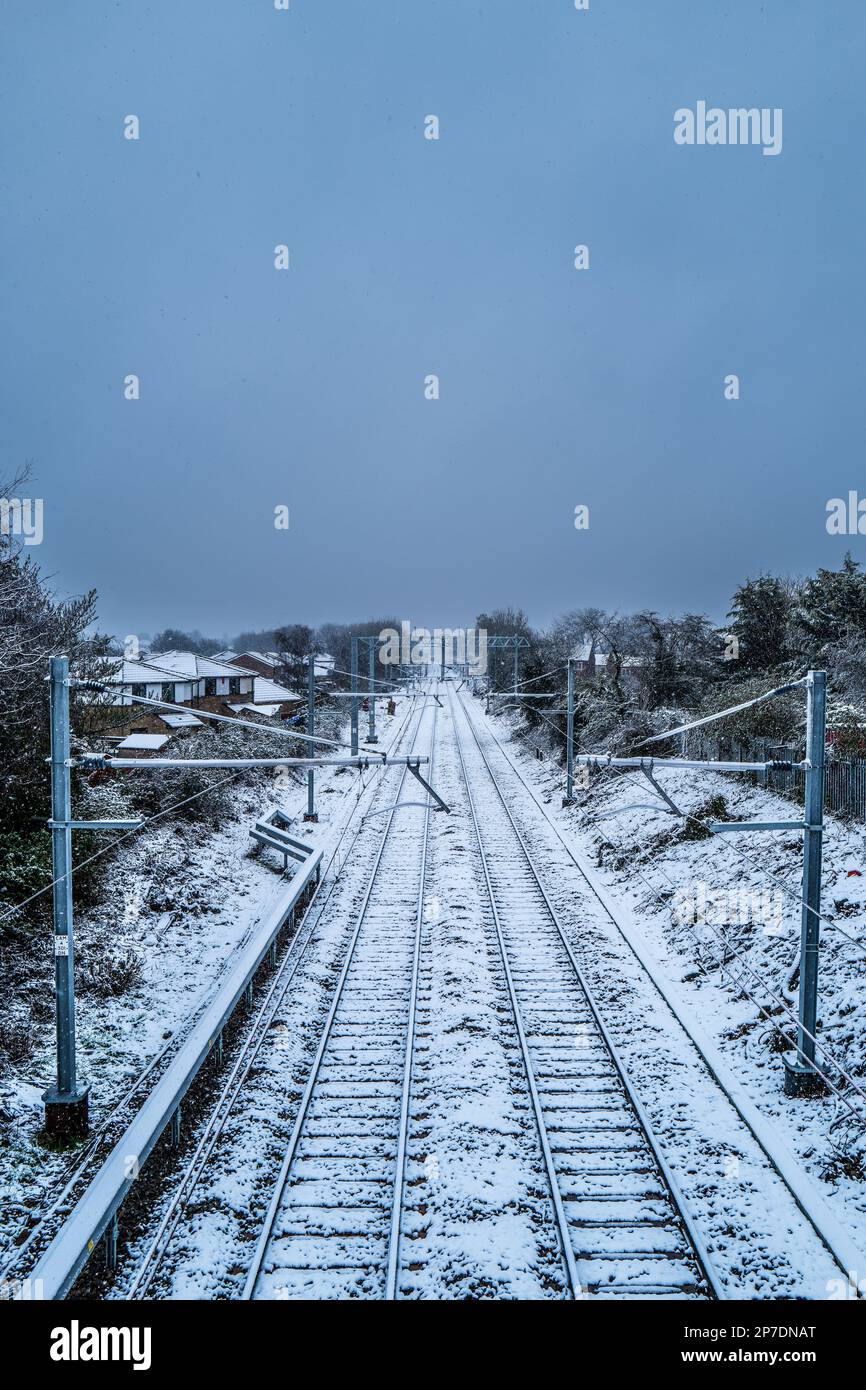 Railway line covered in snow. Winter landscape with empty rail tracks ...