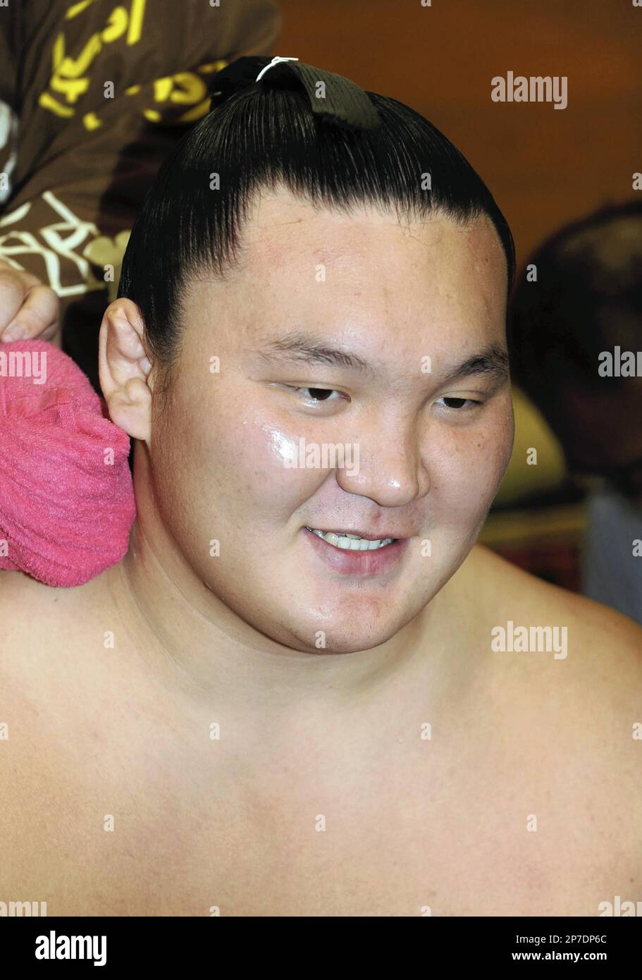 Yokozuna Hakuho, with a smiling on his face, answers questions from the ...