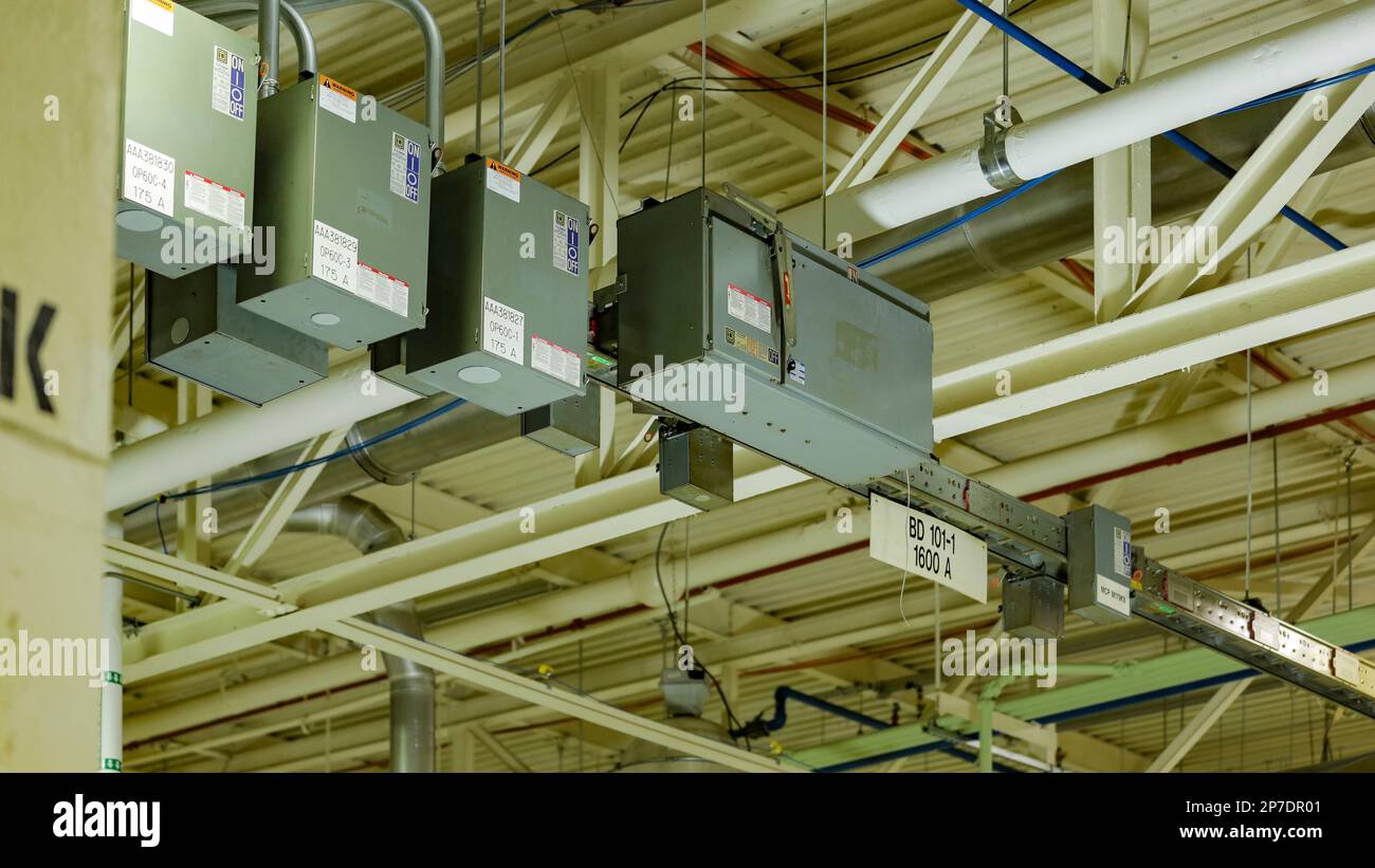 Factory infrastructure of wiring and plumbing Stock Photo - Alamy