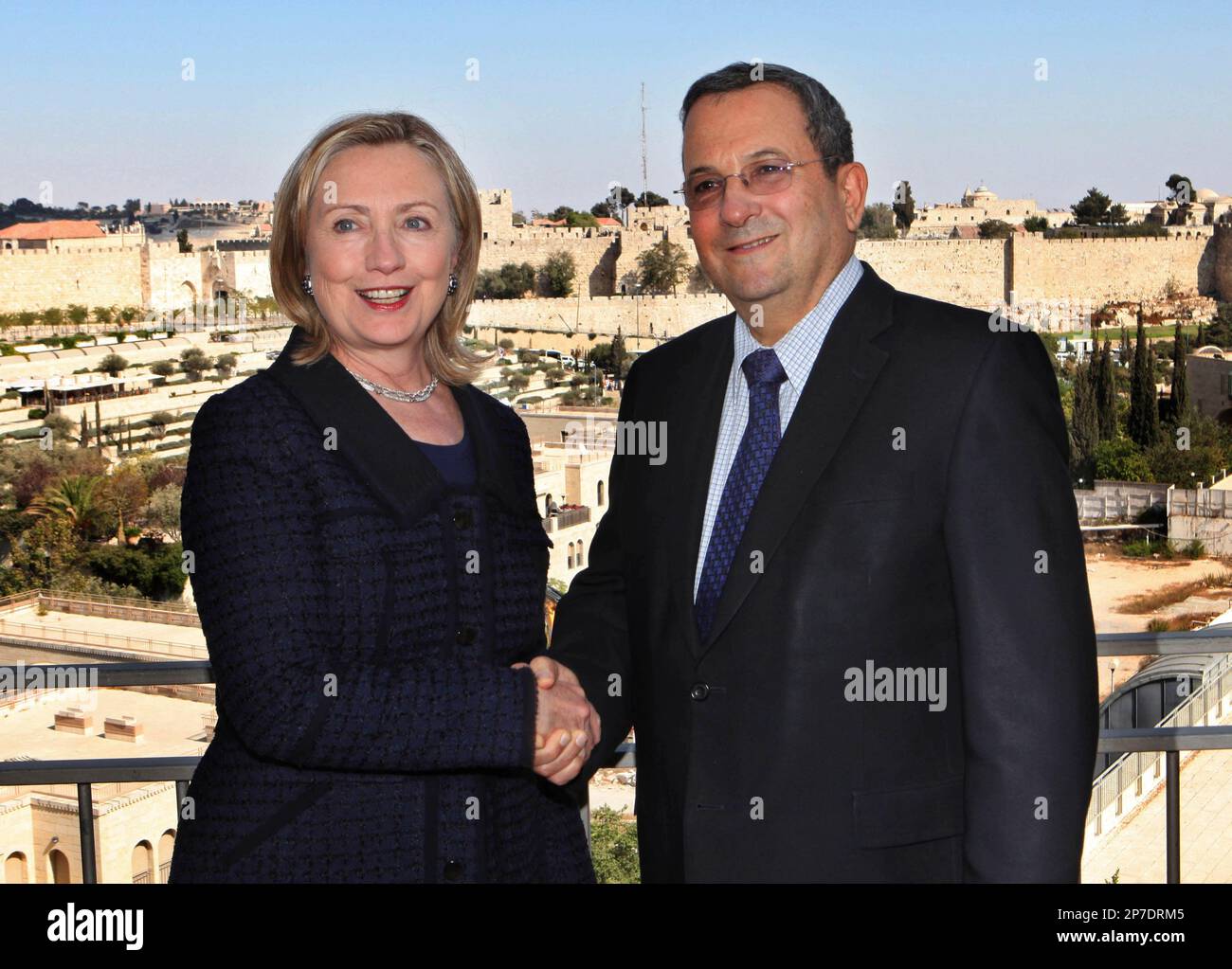US Secretary of State Hillary Rodham Clinton, left, shakes hands with ...