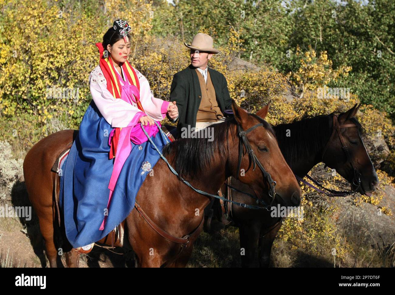 In this Sept. 8, 2010 photo, Maria Yoon holds hands with Matt Mickelson ...
