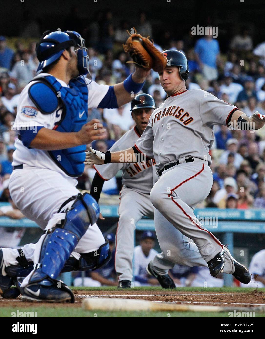 San Francisco Giants' Buster Posey, right, scores past Los Angeles ...