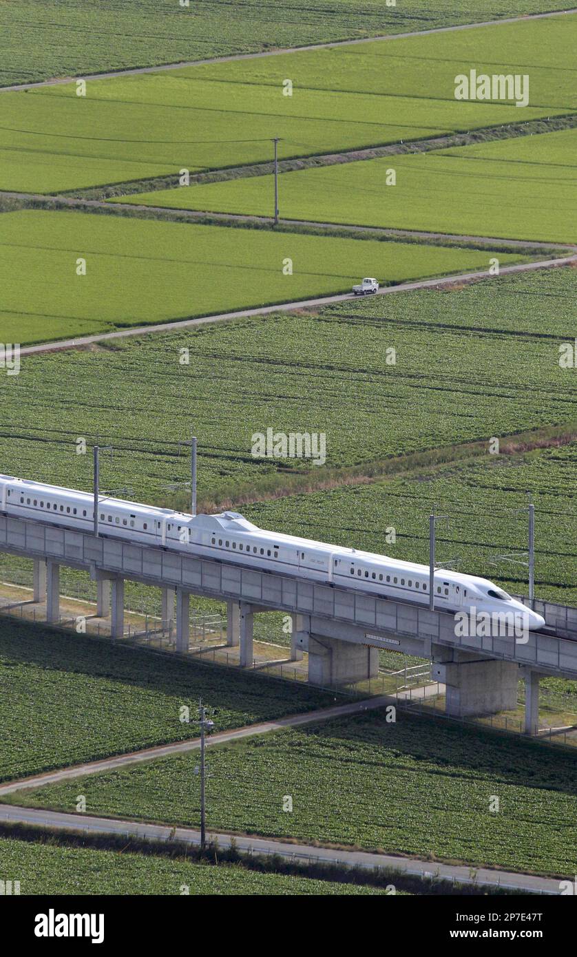 The Sakura (cherry blossom), an N700-series Shinkansen train, bullets ...