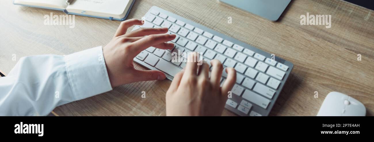 Close up of business woman hands working using keyboard of computer in ...