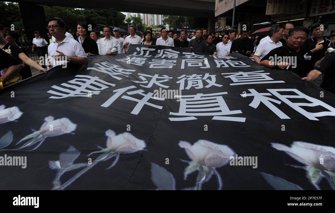 Local residents march to protest the Philippine government over a bus ...